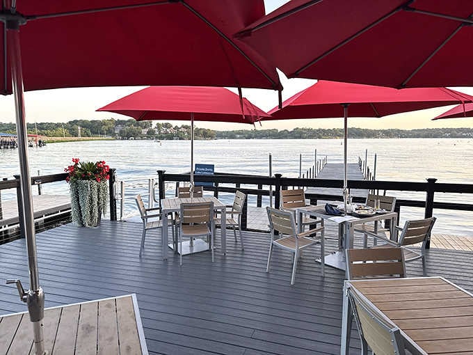 Sunset dining on the deck with those red umbrellas overhead feels like vacation without packing a single suitcase.