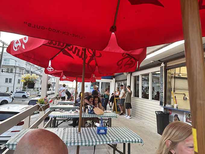 Outdoor seating under red umbrellas means you can enjoy your slice while soaking up that essential Jersey Shore atmosphere.