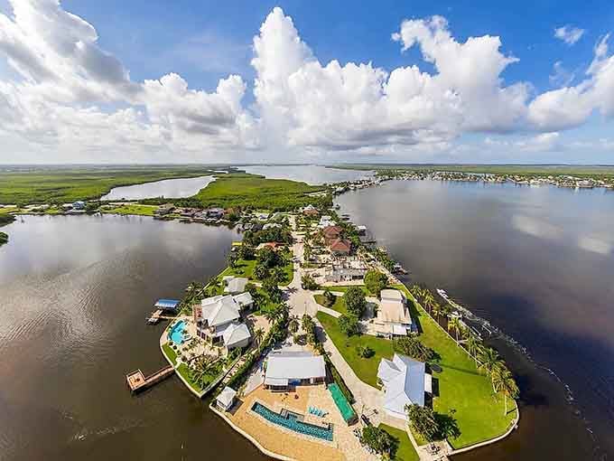 From above, this slender island reveals its secret: a colorful ribbon of life stretched between endless blue waters.