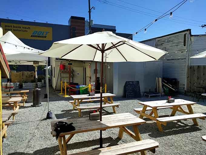 Sunny patio seating with picnic tables where you can enjoy your sandwich without worrying about indoor furniture casualties.