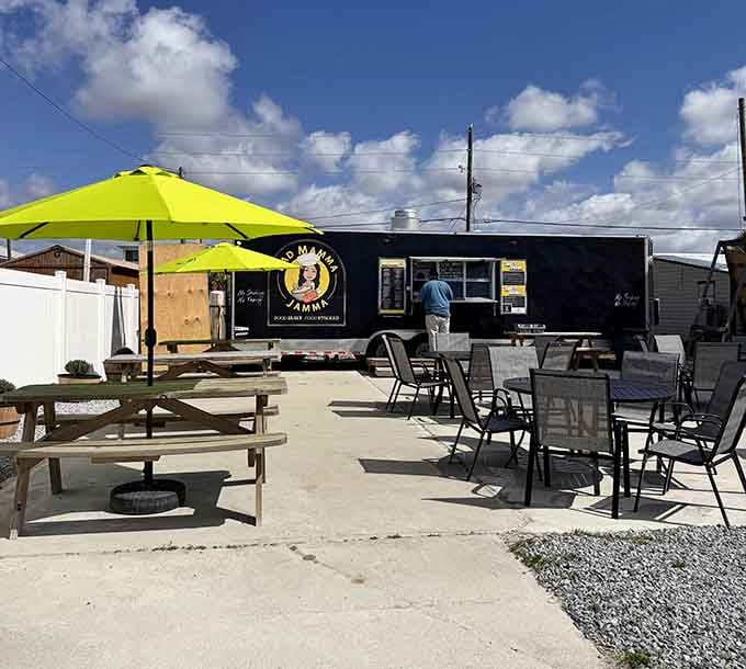 That lime-green umbrella shading outdoor seating practically screams "cold drinks and good times happen here, friend."