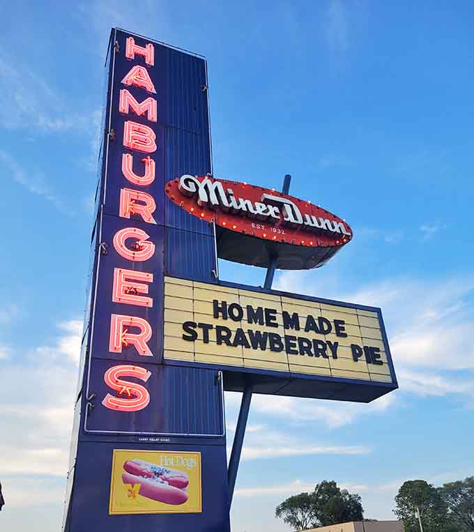 The vintage sign advertising homemade strawberry pie stands as a proud reminder that real food never goes out of style here.