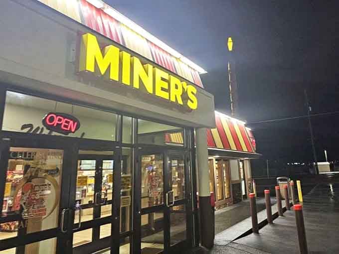 That glowing sign in the evening promises salvation for the hungry traveler passing through town.