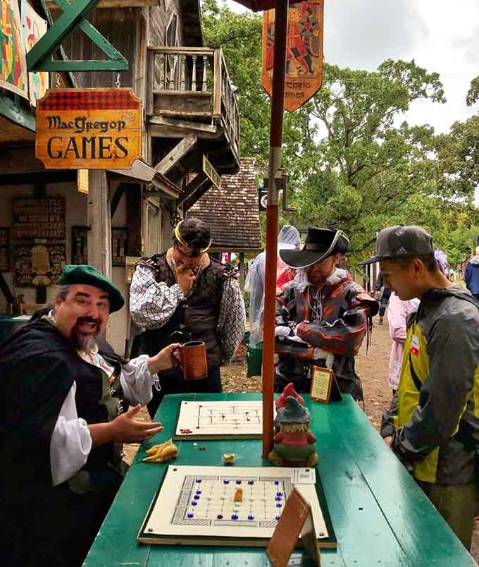 Period-dressed game masters challenge visitors to test their skills at authentic Renaissance-era entertainment options.