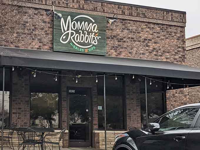 That green and white logo against exposed brick announces you've arrived somewhere special, not just another breakfast joint.