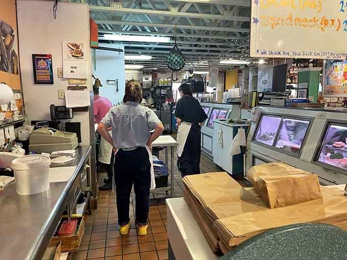 Behind the scenes, the kitchen hums with activity as skilled hands prepare your seafood dreams.