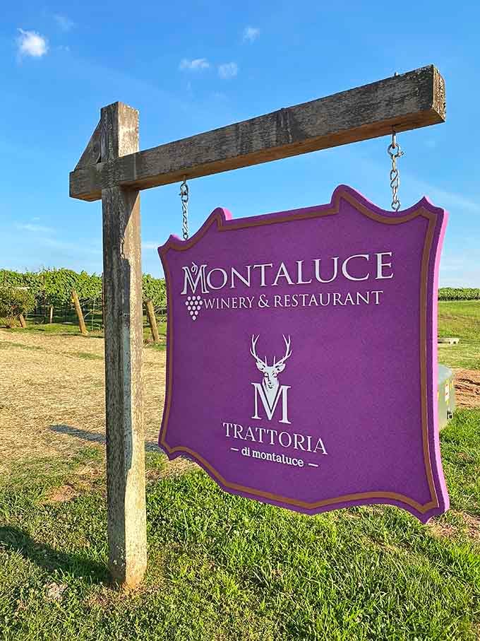 The purple sign that announces you've arrived at your Tuscan destination, no passport or international flight required here.
