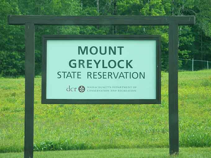 The entrance sign marks where your ordinary day transforms into a genuine mountain adventure.