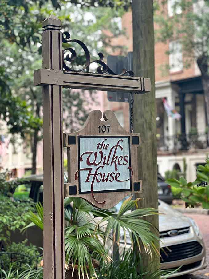 The Wilkes House sign stands as an understated beacon for those seeking authentic Southern hospitality served family-style since 1943.