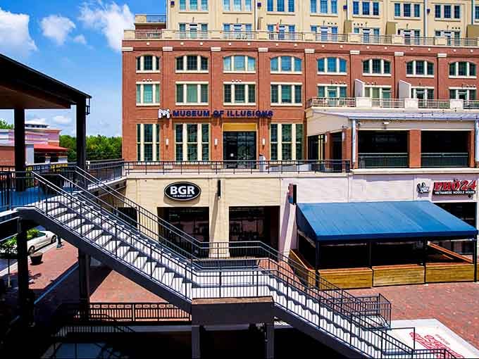 The exterior view showing this mind-bending attraction nestled perfectly into Atlanta's vibrant urban landscape and architecture.