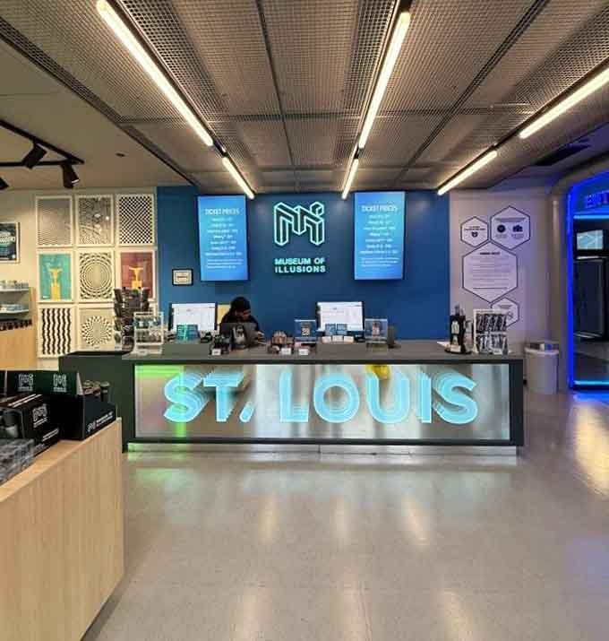 The admission area welcomes you with that glowing St. Louis sign, your gateway to perceptual chaos and fun.