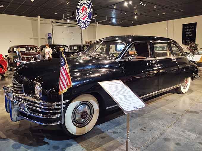 Presidential-worthy black Packard sedan with whitewalls that could still turn heads at any formal event.