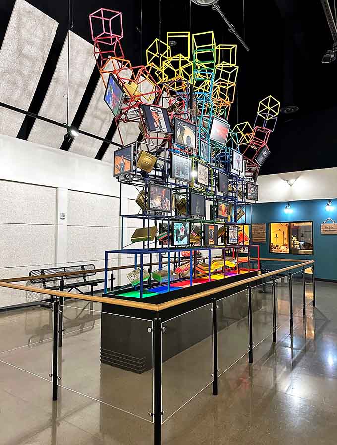 This geometric sculpture towers overhead like a colorful Tetris fever dream, celebrating gaming's artistic side with mat