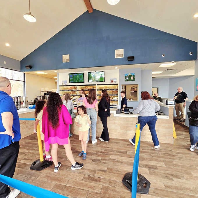 The line moves fast, but nobody minds waiting when donut paradise awaits just a few feet ahead.