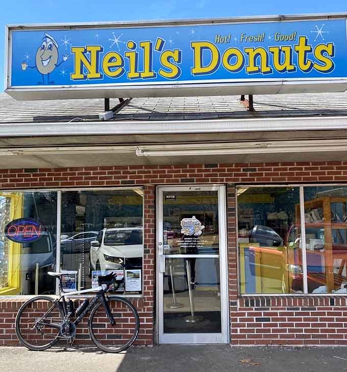 A bicycle parked outside Neil's is basically a Connecticut status symbol, proving someone's commitment to fresh donuts today.