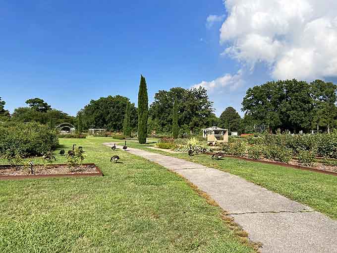 The Italian Garden stretches toward classical structures, blending Old World elegance with Southern charm and impeccable lawn maintenance.