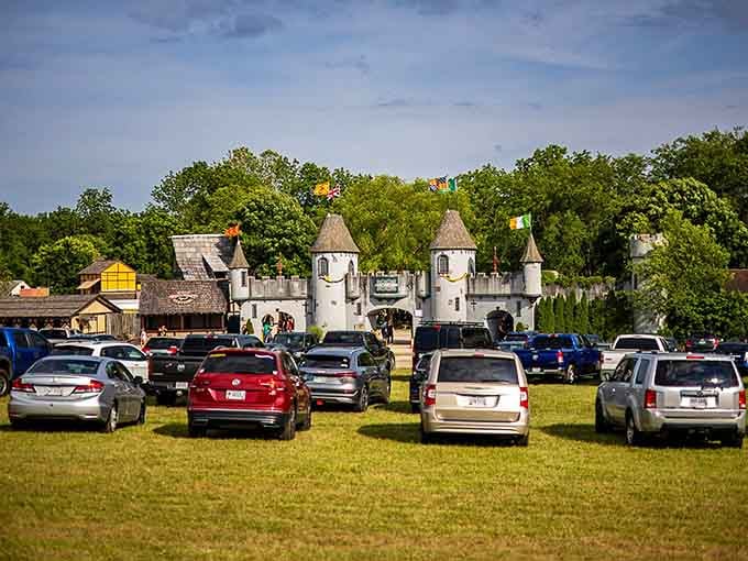 Cars line up outside castle walls, a delightfully absurd collision of centuries that somehow works perfectly.