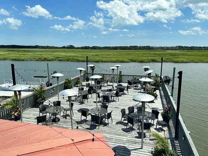 The outdoor deck where you can dine so close to the water you'll swear the shrimp swam straight here.