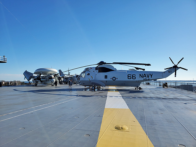 The Sea King helicopter sits ready on the yellow flight line, a veteran of countless missions now enjoying well-earned retirement.