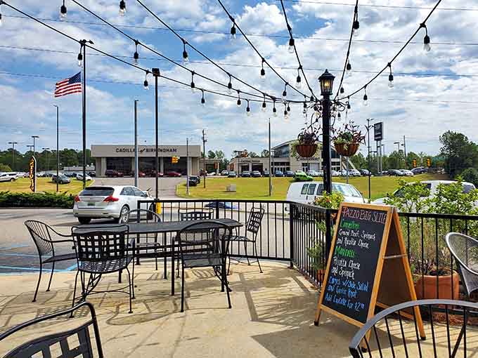 Outdoor seating under string lights, perfect for when you need fresh air after conquering a massive slice.