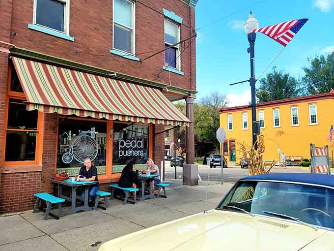 The striped awning and turquoise tables make this corner of Lanesboro look like a postcard from a better, simpler time.