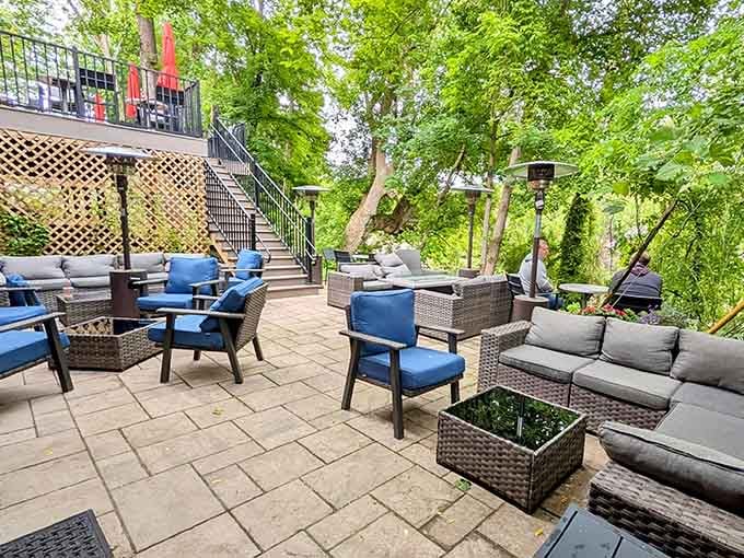 Spacious outdoor lounge area with blue cushions inviting you to stay awhile and forget your to-do list.