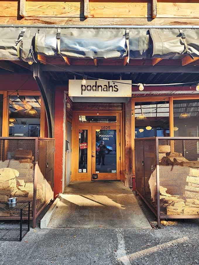 The entrance welcomes you with rustic charm, promising smoky goodness and satisfied appetites just steps away.