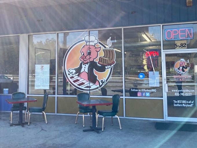 Outdoor seating with a view of cheerful pig cartoons, because great barbecue tastes even better with whimsical company nearby.