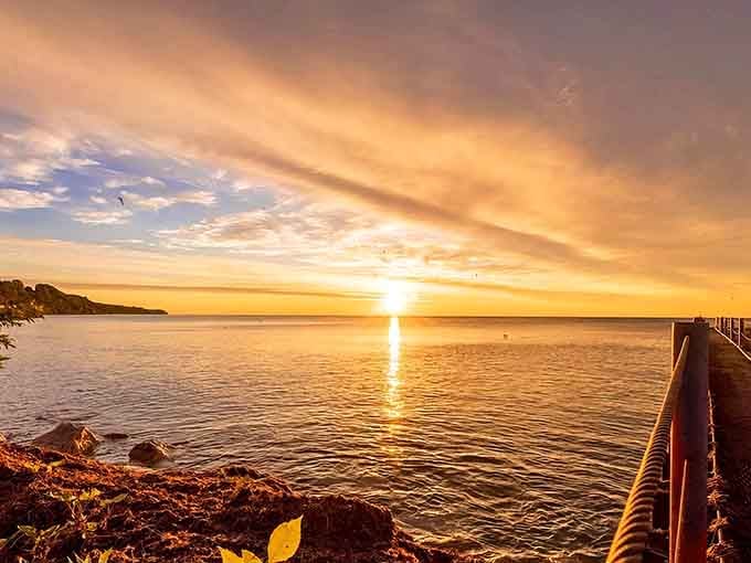 Lake Michigan sunrises paint the sky in golden hues, reminding you why waterfront towns capture hearts and Instagram feeds.