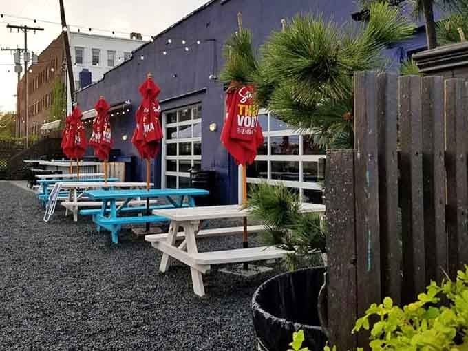 Outdoor seating with picnic tables and umbrellas creates the perfect summer evening vibe year after year.