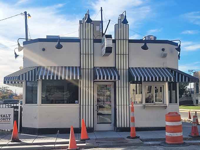 The Art Deco facade stands as a monument to simpler times when burgers were cheap and joy abundant.