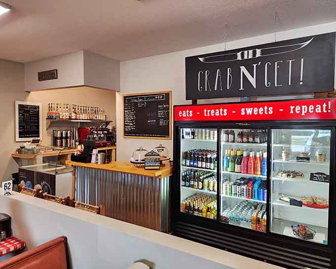 A cheerful sign reminds you that life's simple pleasures include eats, treats, sweets, and enthusiastically repeating the cycle.