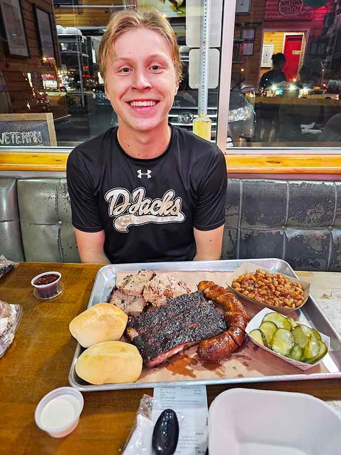 That smile says it all: this is what happiness looks like when it's served on a tray with ribs.
