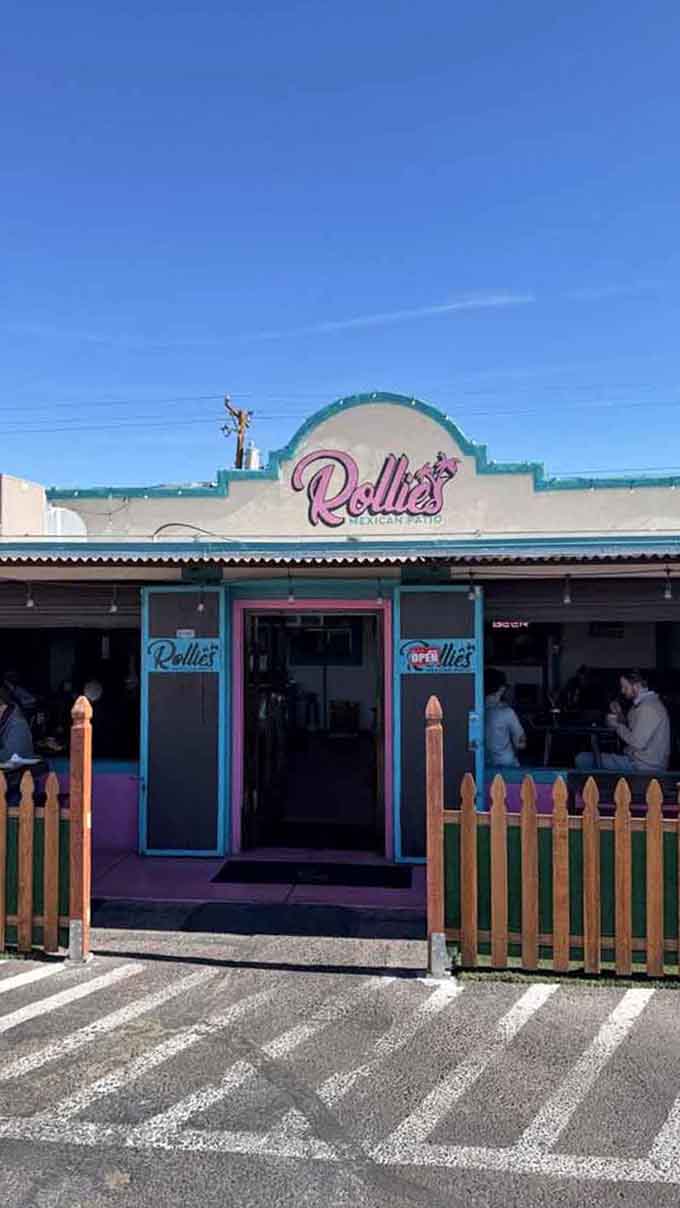 That welcoming entrance with its bright colors and open sign is basically waving you in for tacos.