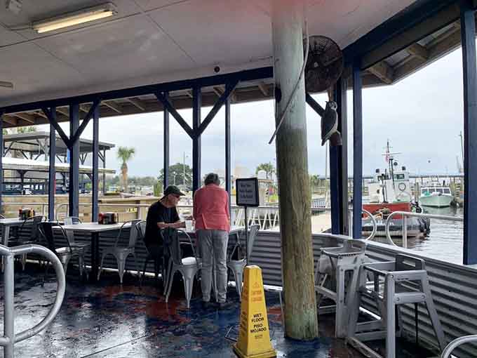 Waterfront dining where you can watch boats drift by while contemplating whether to order another round of those legendary hush puppies.t #3) patio
