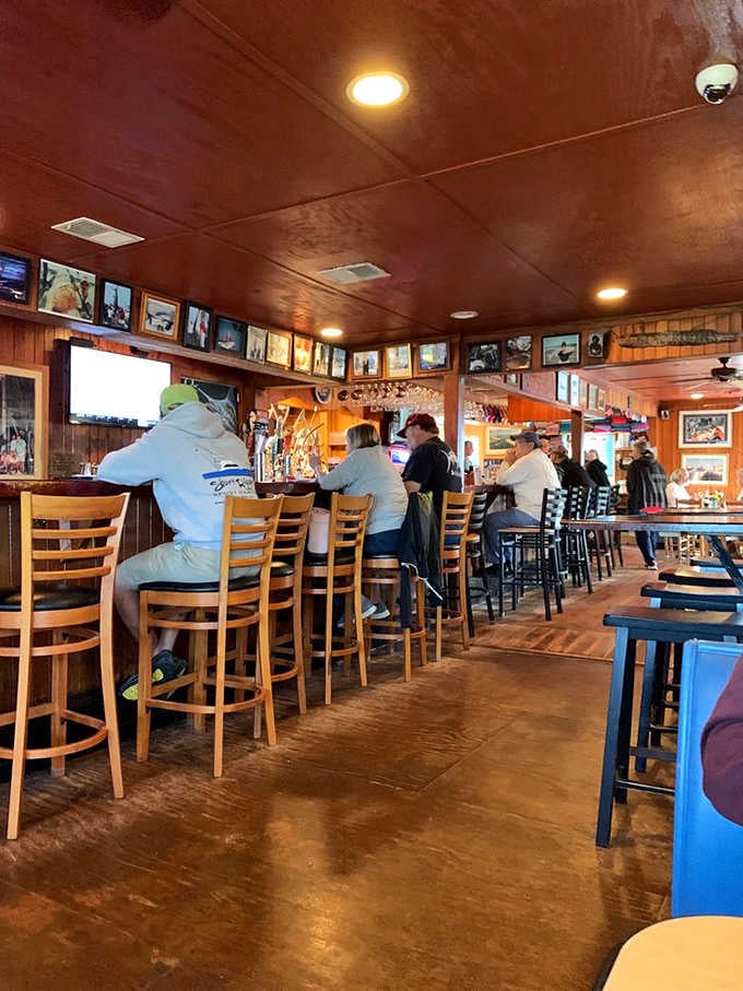 The bar counter where locals and visitors alike gather, sharing stories over plates of the ocean's finest offerings.