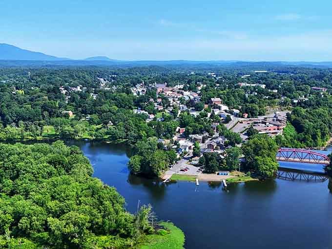 Aerial view reveals a town nestled in greenery where the Hudson River and mountains conspire to create magic.