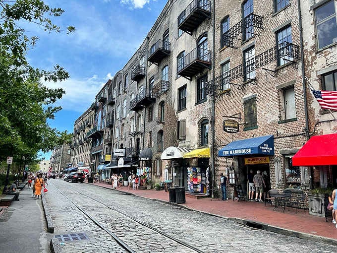 Those wrought-iron balconies overlook River Street where tourists and history collide on ankle-testing cobblestones below.