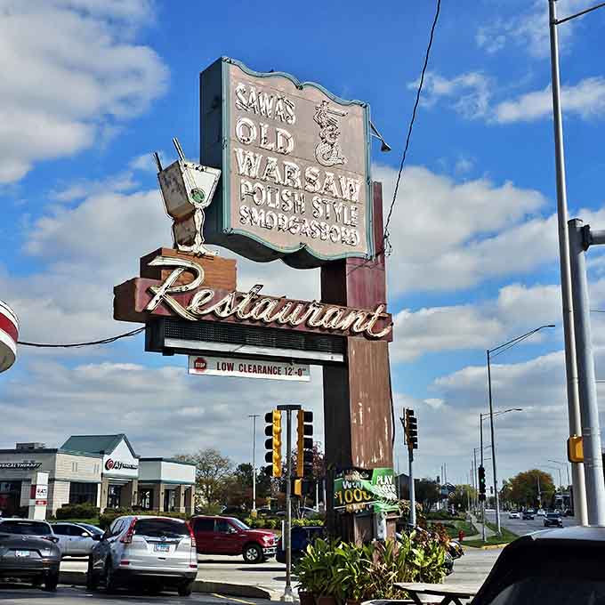 The classic roadside sign stands proud, a beautiful relic from when restaurants earned loyalty through food, not filters.