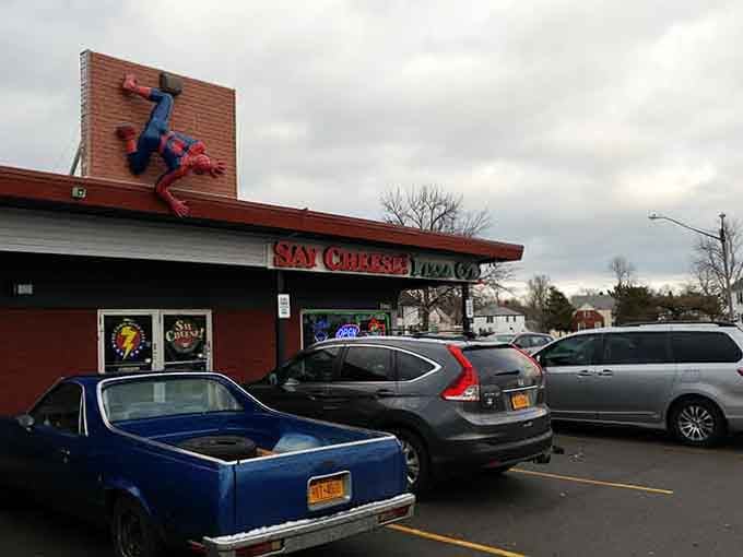The exterior view that stops traffic, literally, because who can resist a restaurant with Spider-Man scaling the roof?