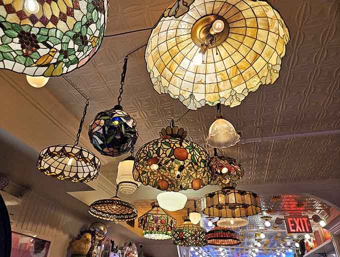 Tiffany lamps clustered overhead like a stained-glass garden create lighting that's equal parts museum and your favorite childhood memory.
