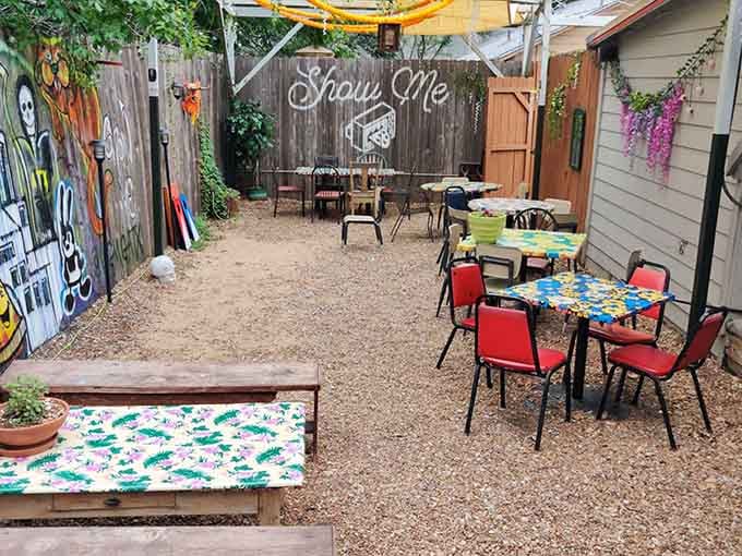String lights and hand-painted furniture create an enchanting backyard oasis where pizza tastes even better under open skies.