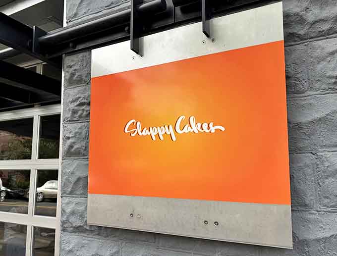 That signature orange and white logo promises exactly what it delivers: a place where happiness comes with syrup.