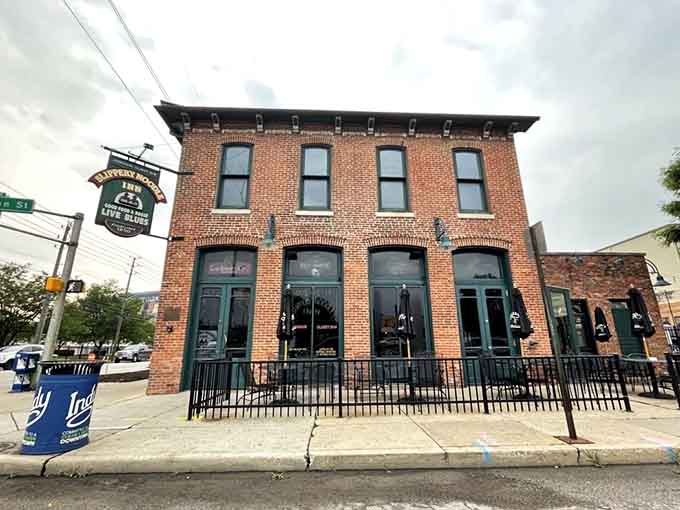 The restored brick facade stands proud on the corner, a testament to Indianapolis history that refuses to fade away.