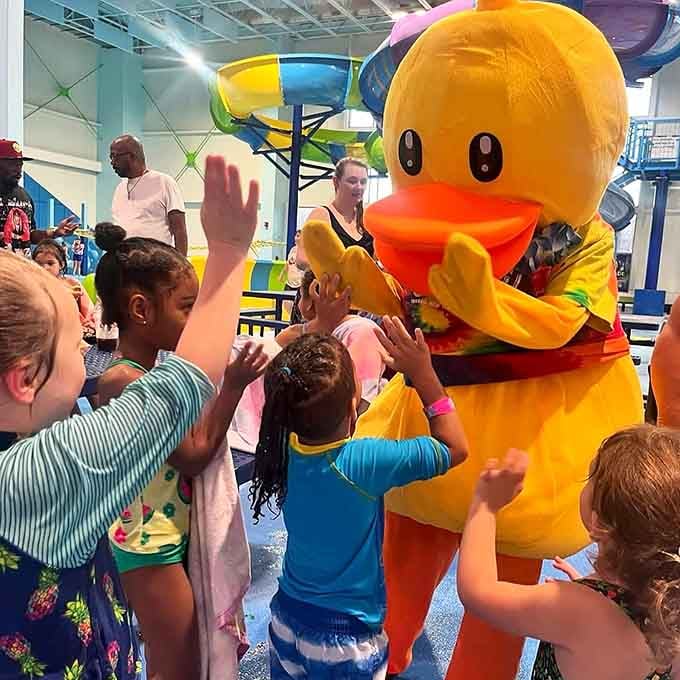 The cheerful mascot greets young fans with high-fives, spreading joy and probably wondering how hot that costume gets.