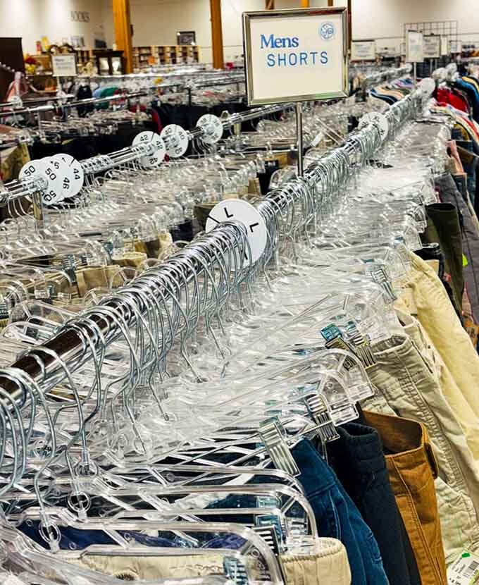 Men's shorts organized by size on endless racks, proving that summer wardrobes don't require draining your retirement fund after all.