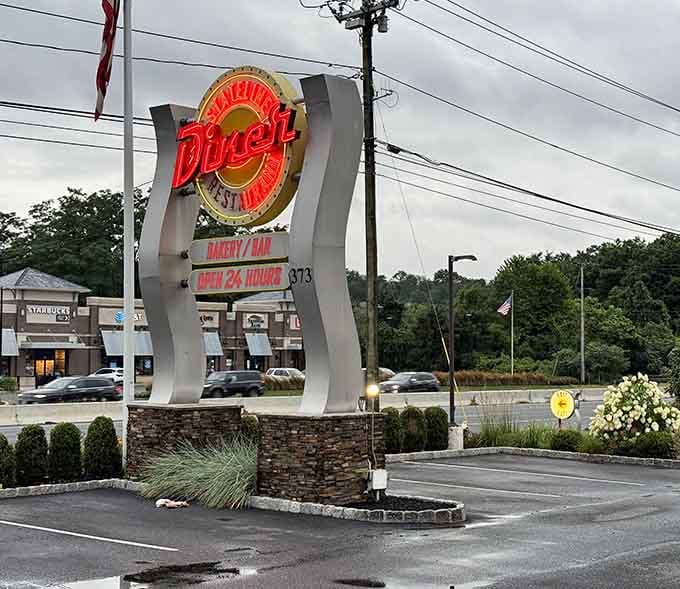 That classic diner sign standing tall tells passing drivers that good food and generous portions are just a turn away from the highway.