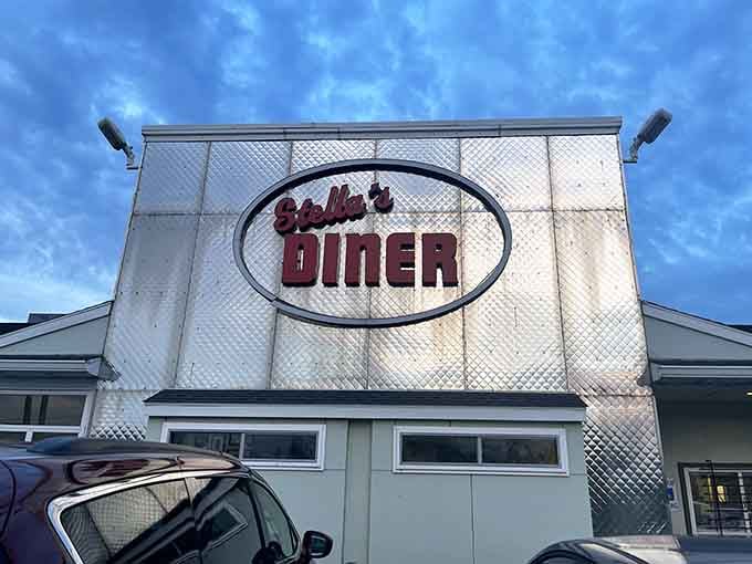 The gleaming Stella's Diner sign beckons like a beacon of breakfast hope against the Syracuse sky.