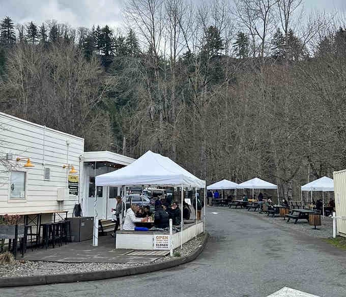 Even on overcast days, those white tents and picnic tables create a gathering spot that feels like home.