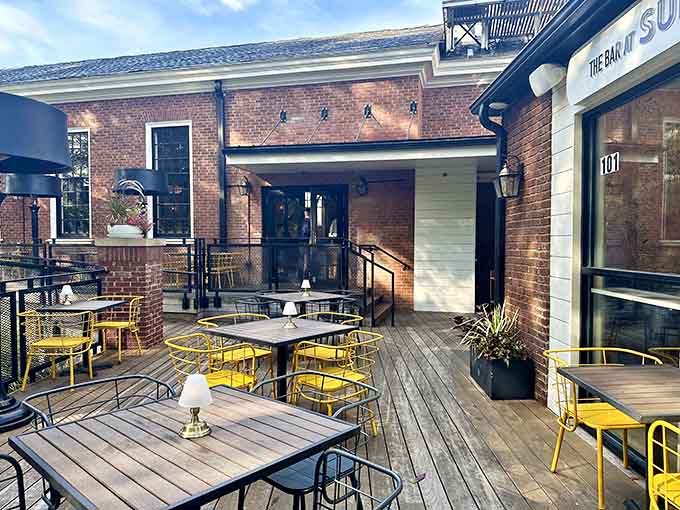 Cheerful yellow seating on the deck adds a pop of sunshine to your dining experience, perfect for Instagram moments.